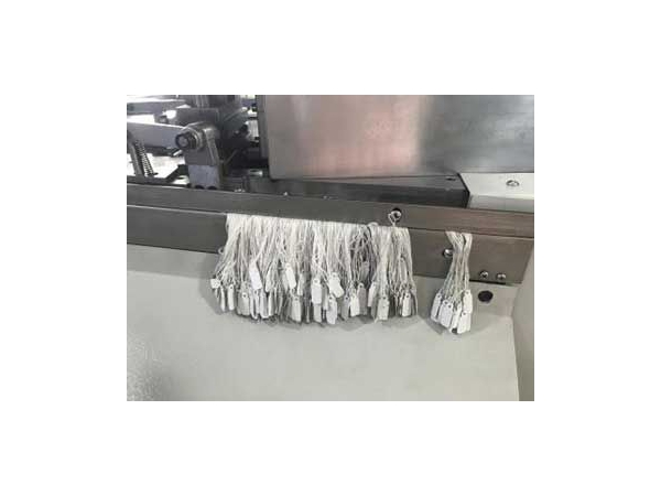 Hang Tag Stringing Machine | Tag Tying Machine | Universal Machinery ...